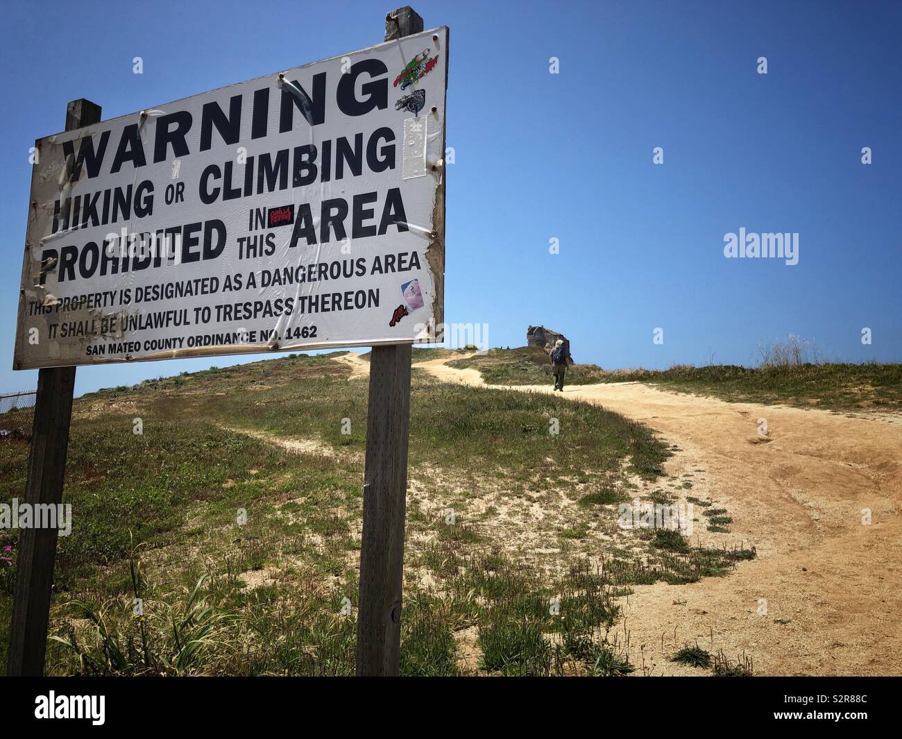 Warning sign at the curious bunker at Devils Slide on the coast of ...