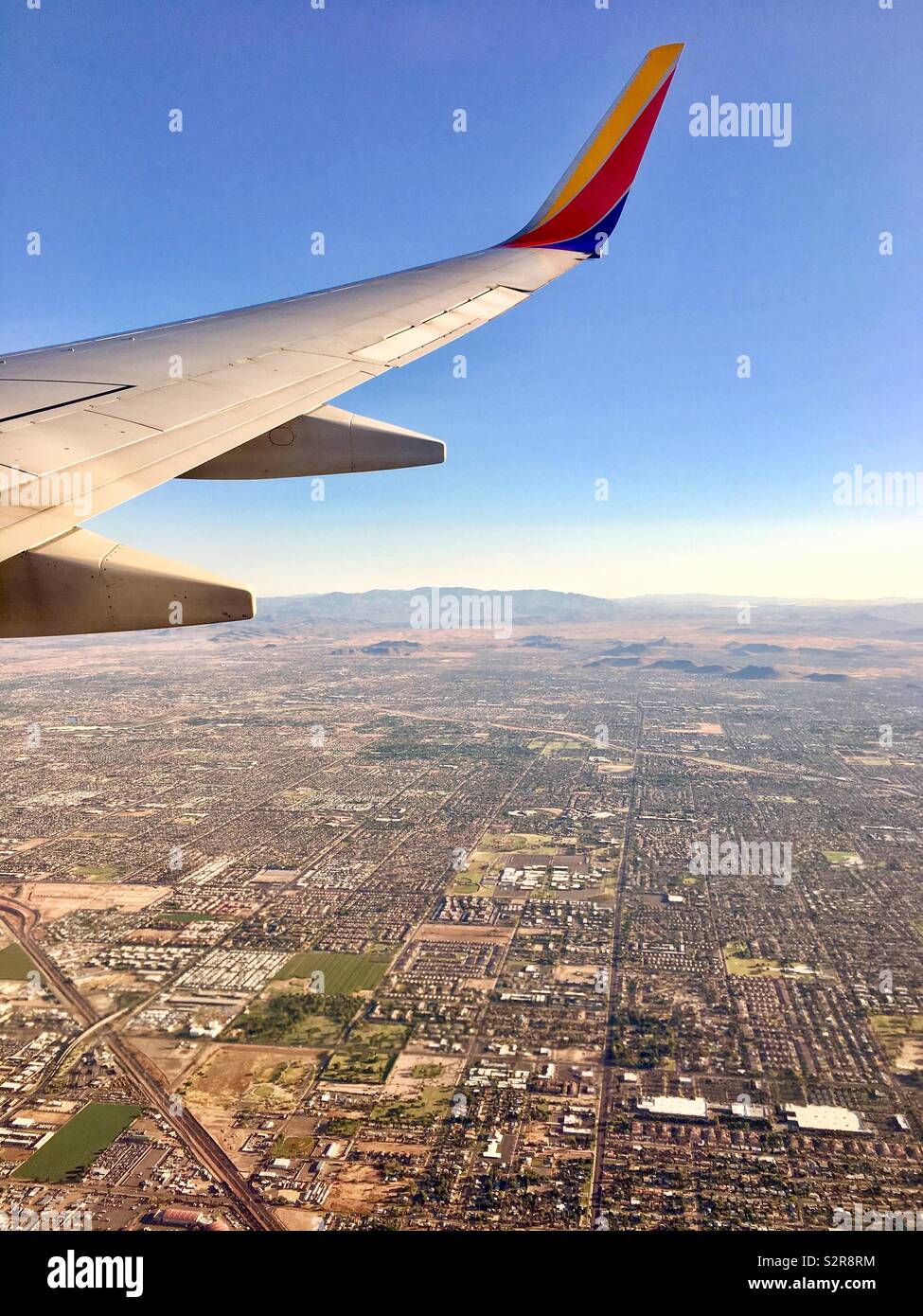 Southwest Airlines flight flying over Phoenix, AZ in the summertime ...