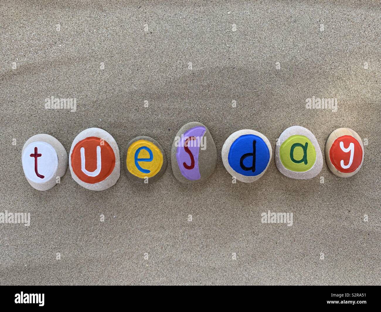 Tuesday text with colored stone letters Stock Photo - Alamy