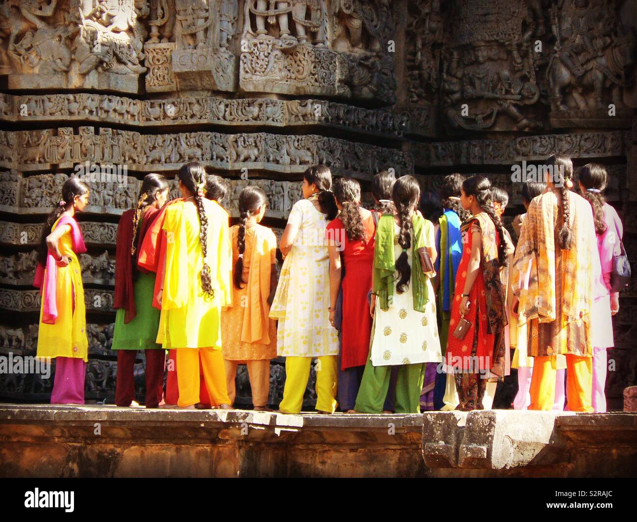 Indian girls in front of a temple Stock Photo - Alamy