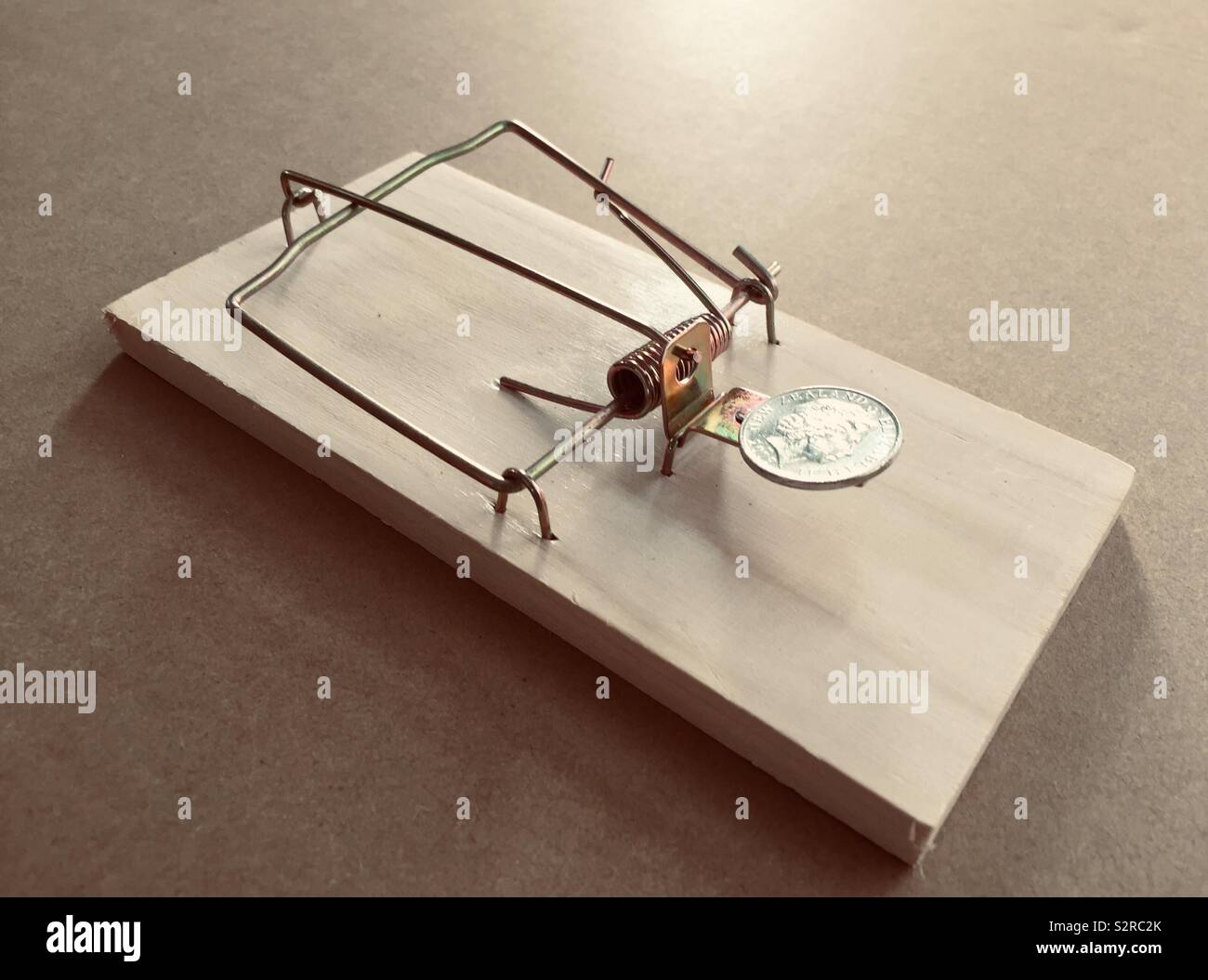 The money trap Stock Photo - Alamy