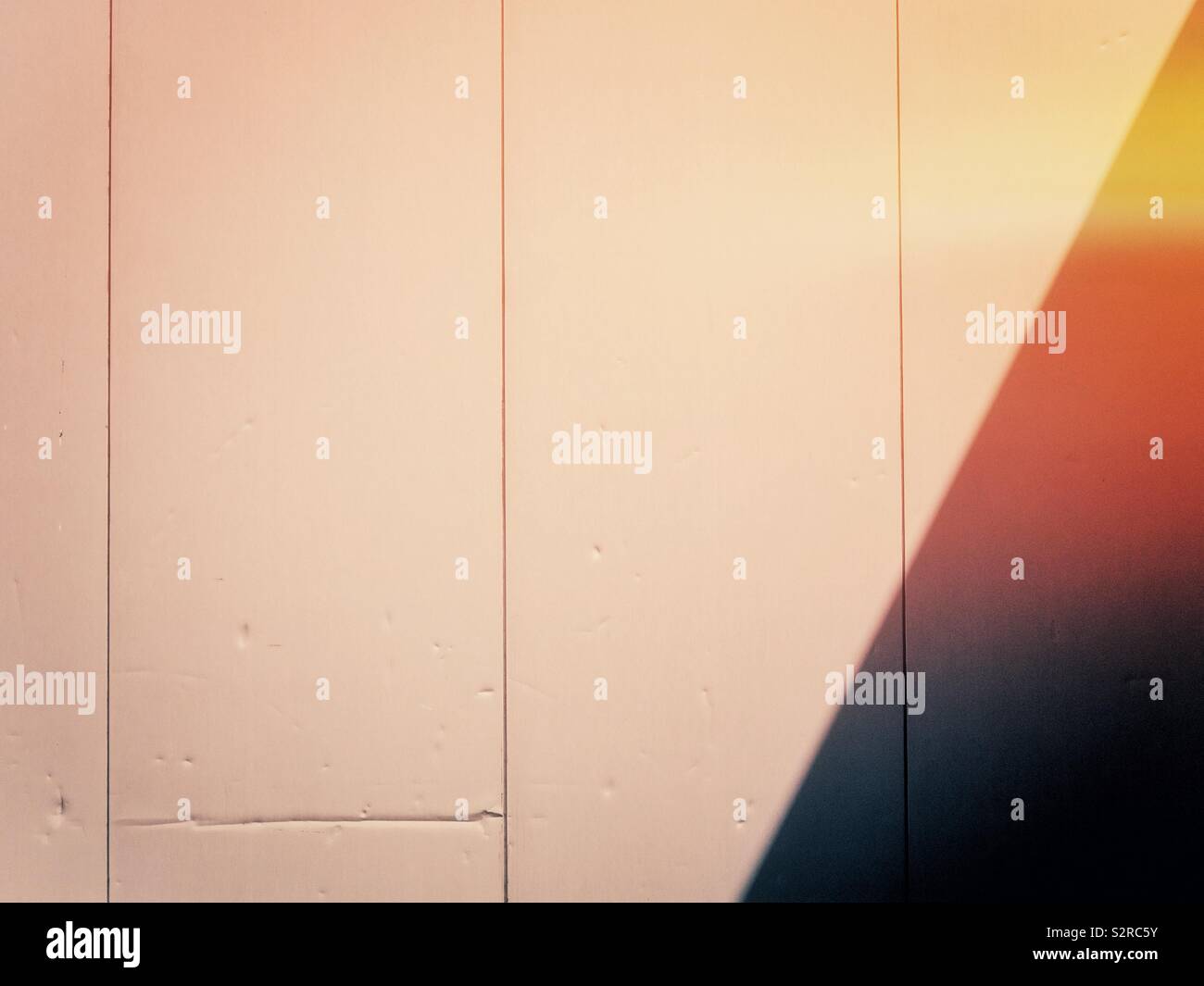 Wall with lines and diagonal shadow Stock Photo - Alamy