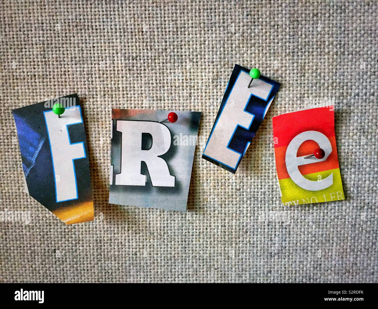 The word free on a bulletin board using cut out paper letters with the ...