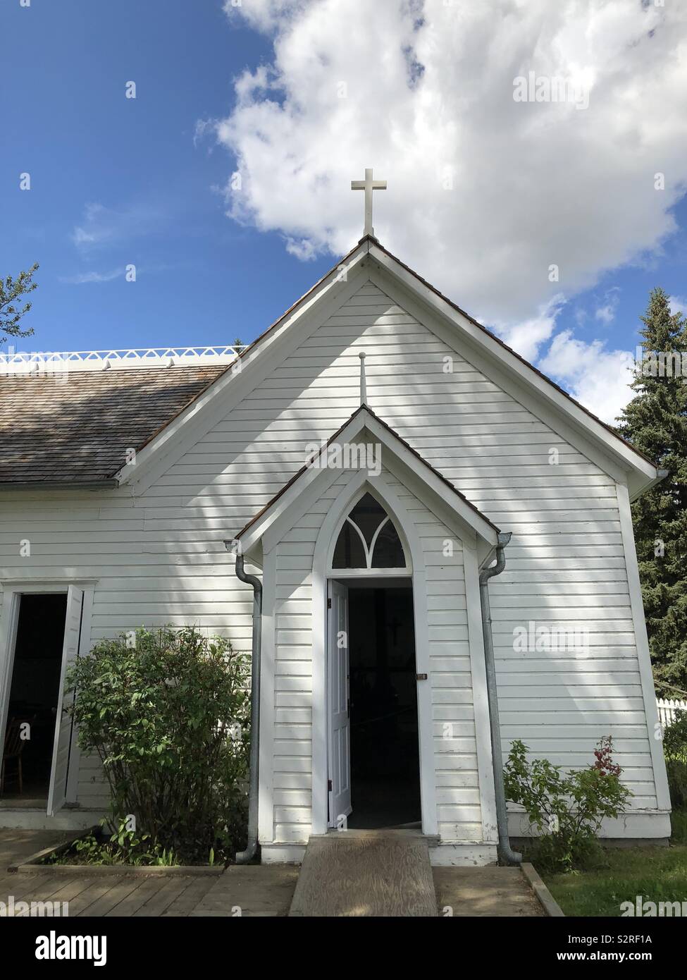 Heritage wood frame church at the historic fur trading post and ...