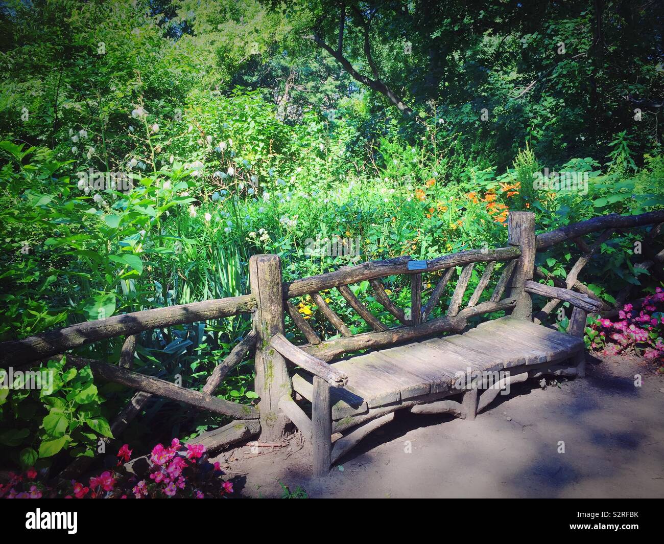 Natural wooden bench and fence in a rustic setting near Shakespeare ...