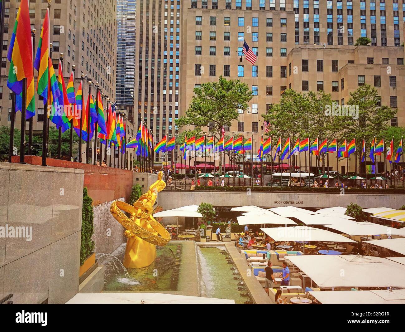 The promenade at Rockefeller Center is ringed by rainbow flags celebrating world pride, NYC, USA ...