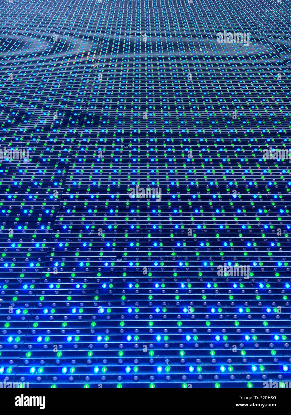 Huge matrix computer screen rolling with blue and green dots Stock ...