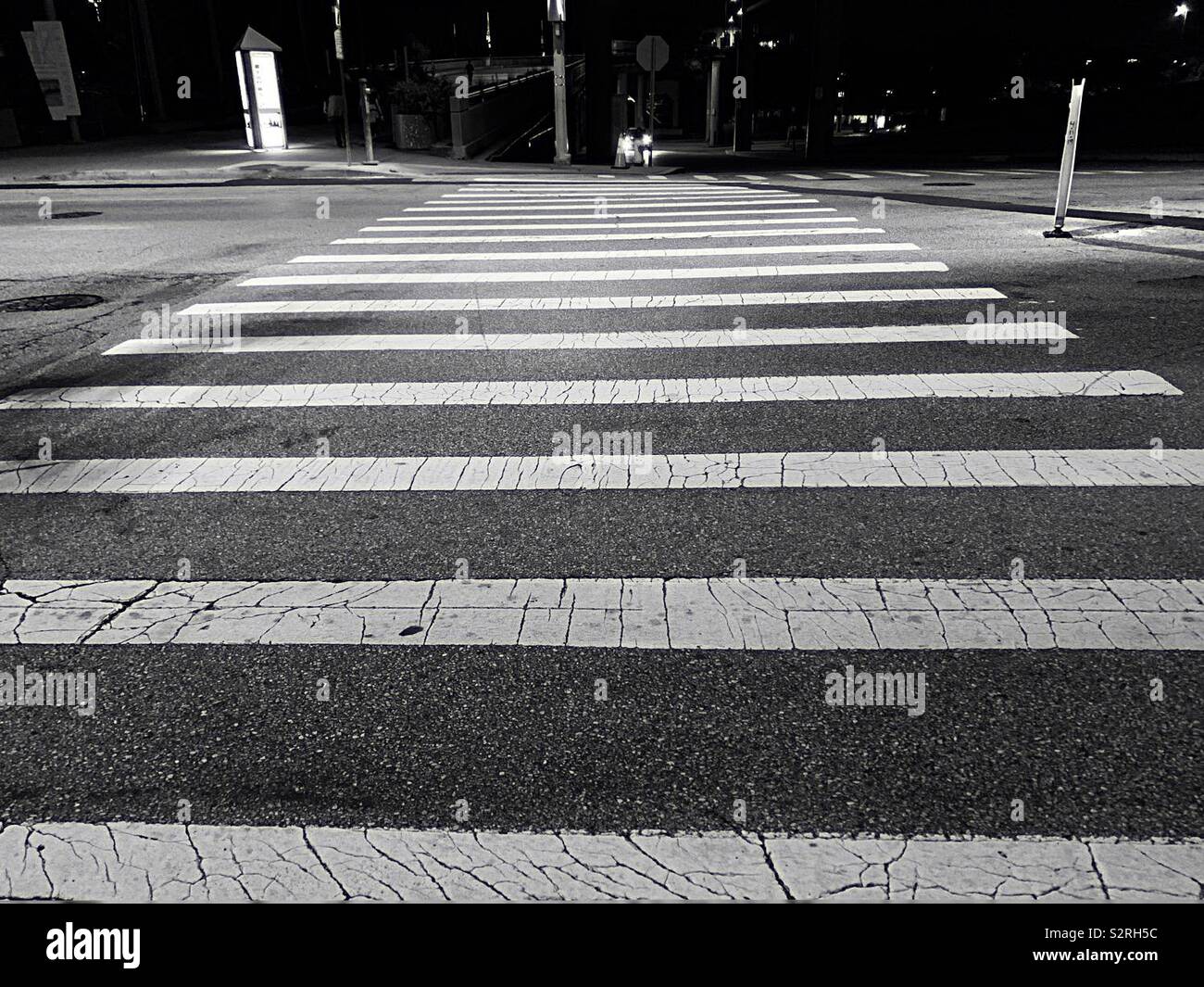 Night crosswalk at bridge in Ohio in black and white under street ...
