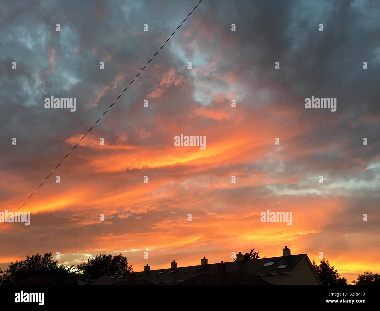 Beautiful sunset across the rooftops Stock Photo - Alamy