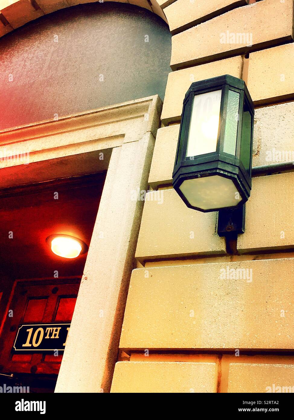 Main entrance and antique lamp at the NYPD 10th precinct in Chelsea ...