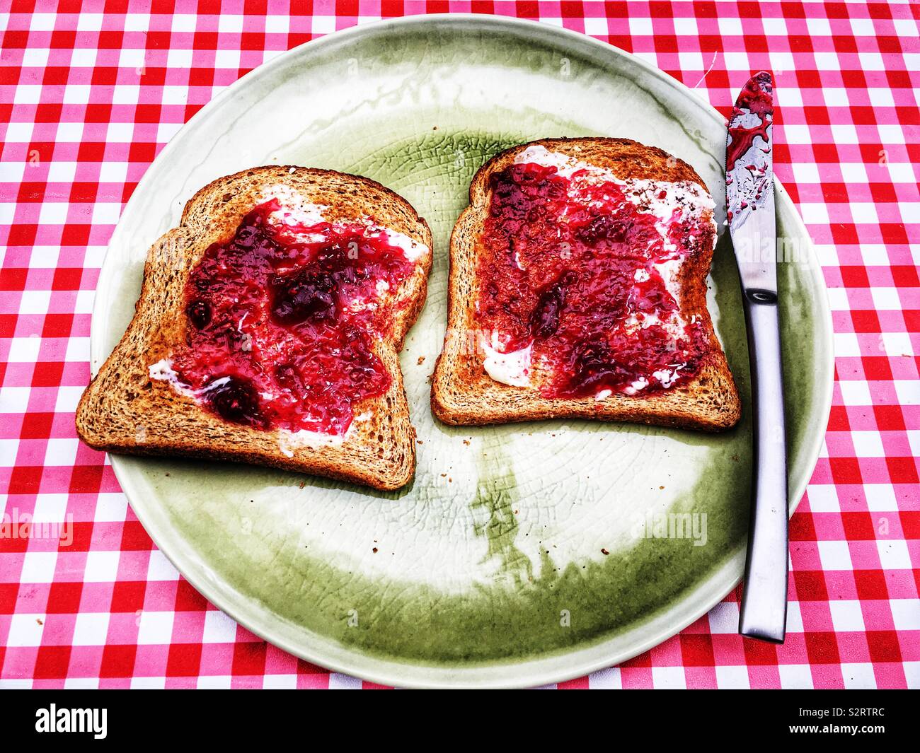 Homemade raspberry jam on wholemeal toast Stock Photo - Alamy