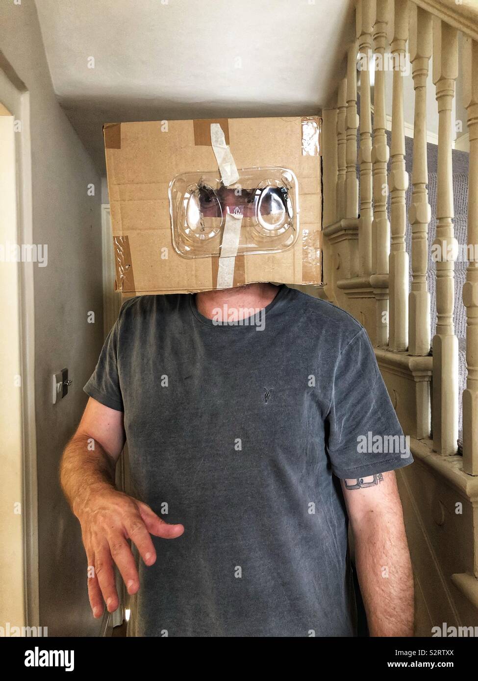 Man in cardboard space helmet Stock Photo - Alamy