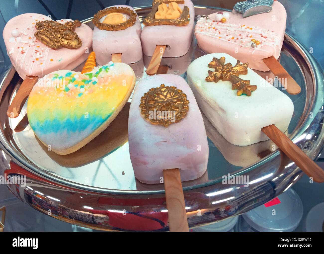 Bakery Display of cake pops, small cakes on popsicle sticks, United ...