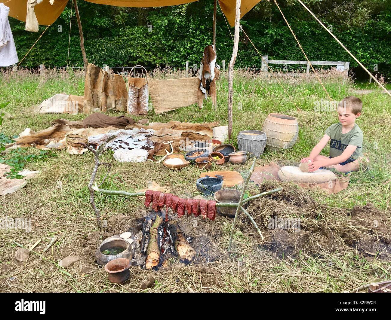 Child in Neolithic camp setting Stock Photo - Alamy