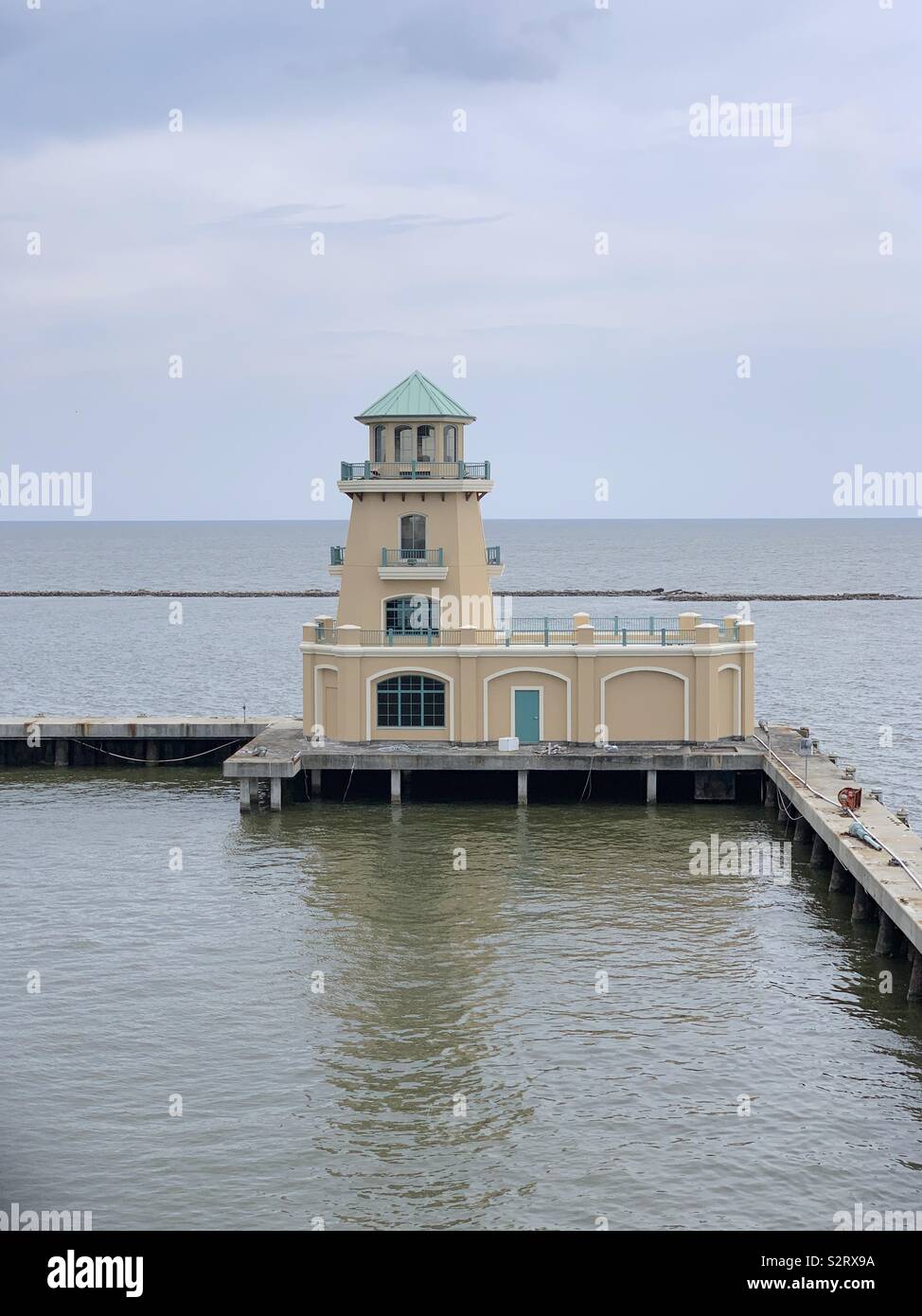 Closeup view of a beautiful lighthouse in the ocean Stock Photo - Alamy