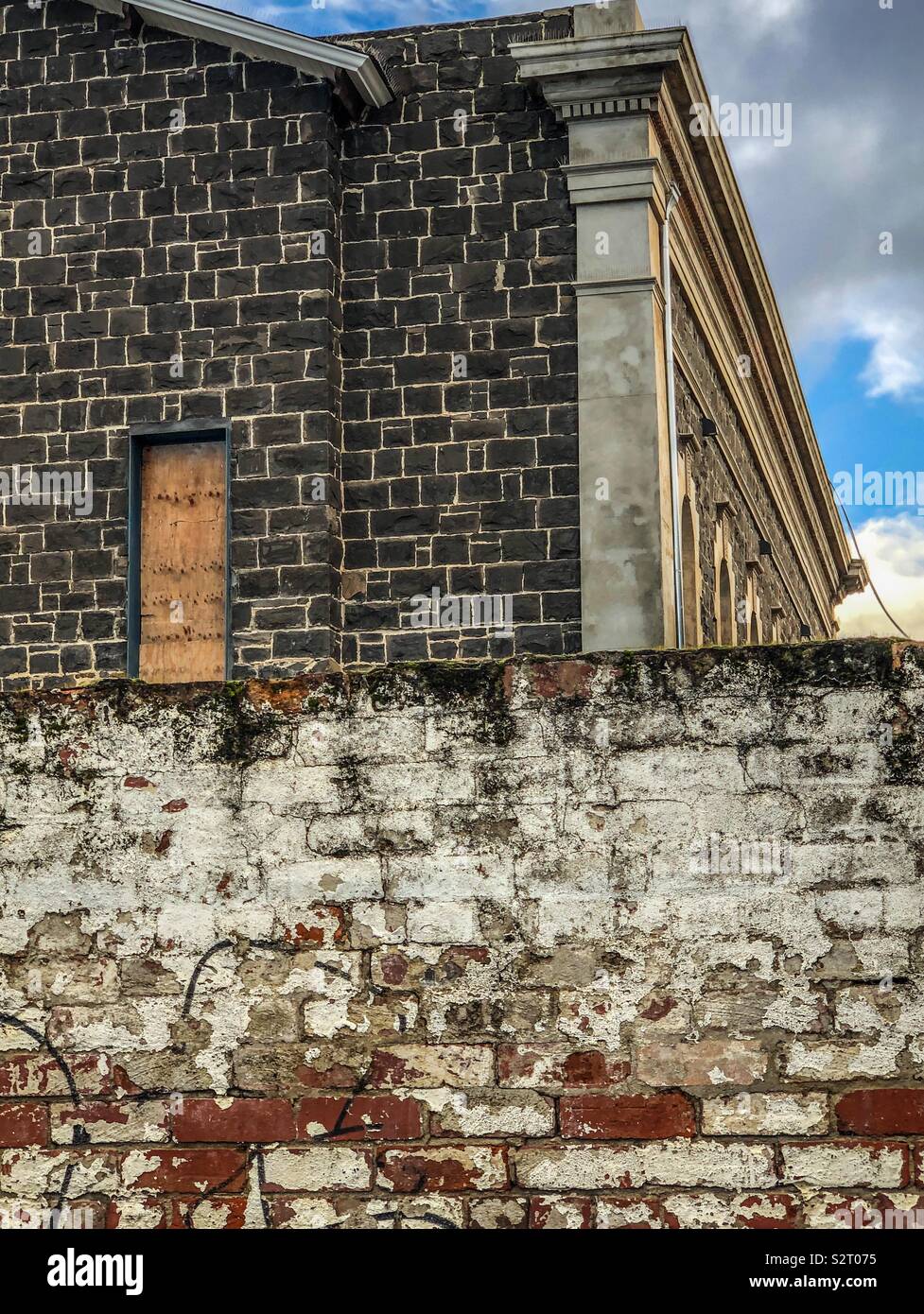 Brick wall - stone building - winter light Stock Photo - Alamy