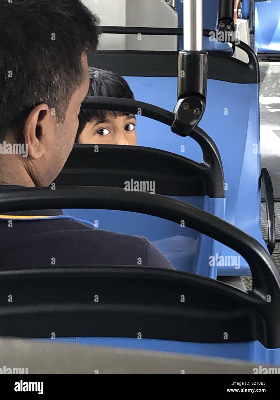 Boy sneaking peaks at me on bus, Venice, italy, 2019 Stock Photo - Alamy