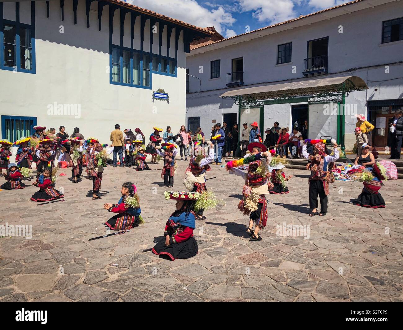 Colourfully dressed Peruvian children rehearsing practicing practising ...