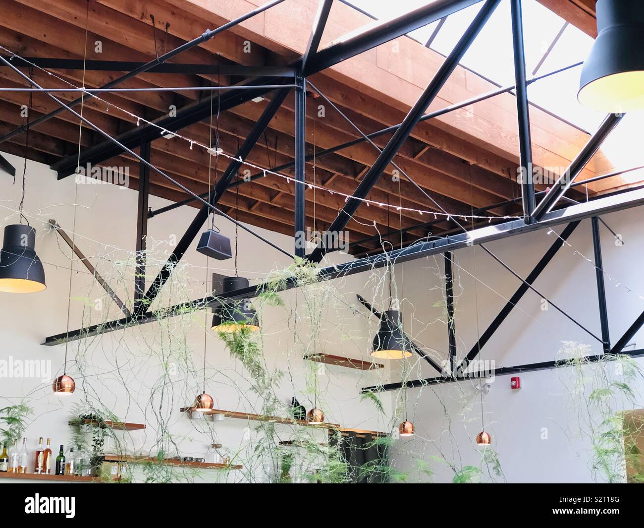 Open concept architecture and exposed beams in a modern restaurant ...