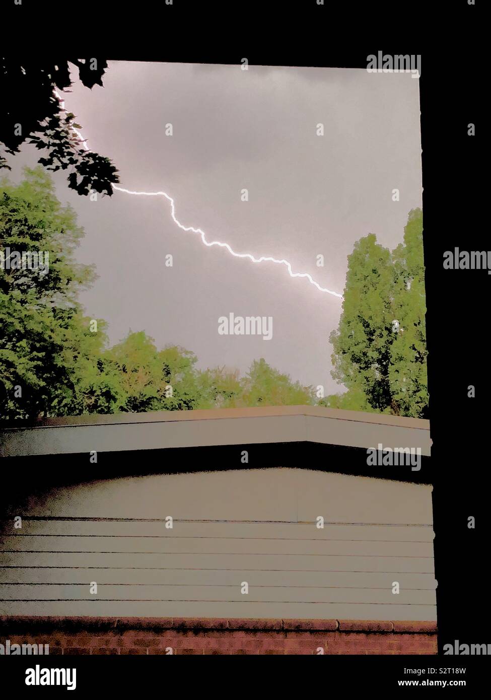 Lighting strike in residential neighborhood- Hand-held, manual capture ...