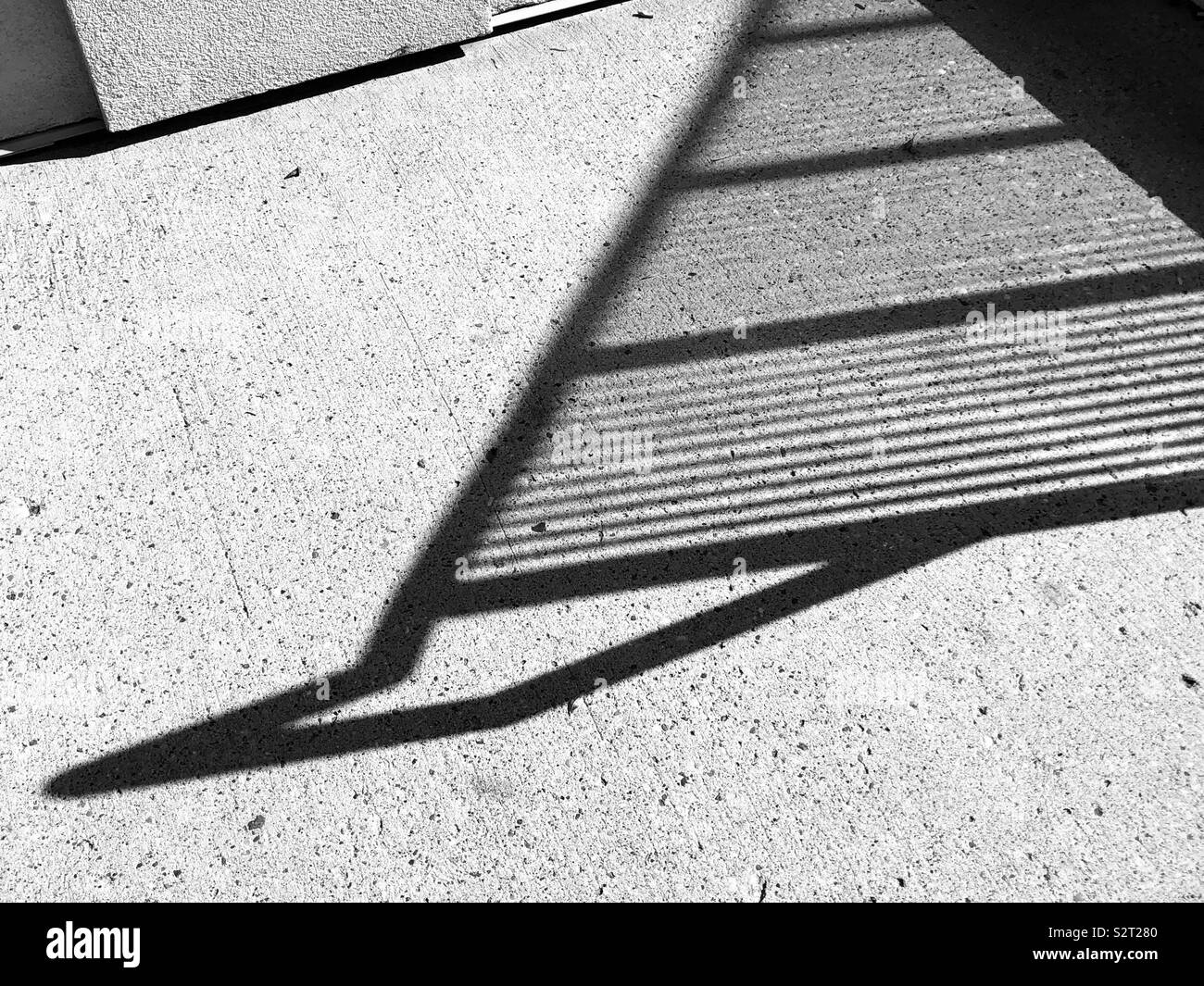 Shadow on the pavement Stock Photo - Alamy
