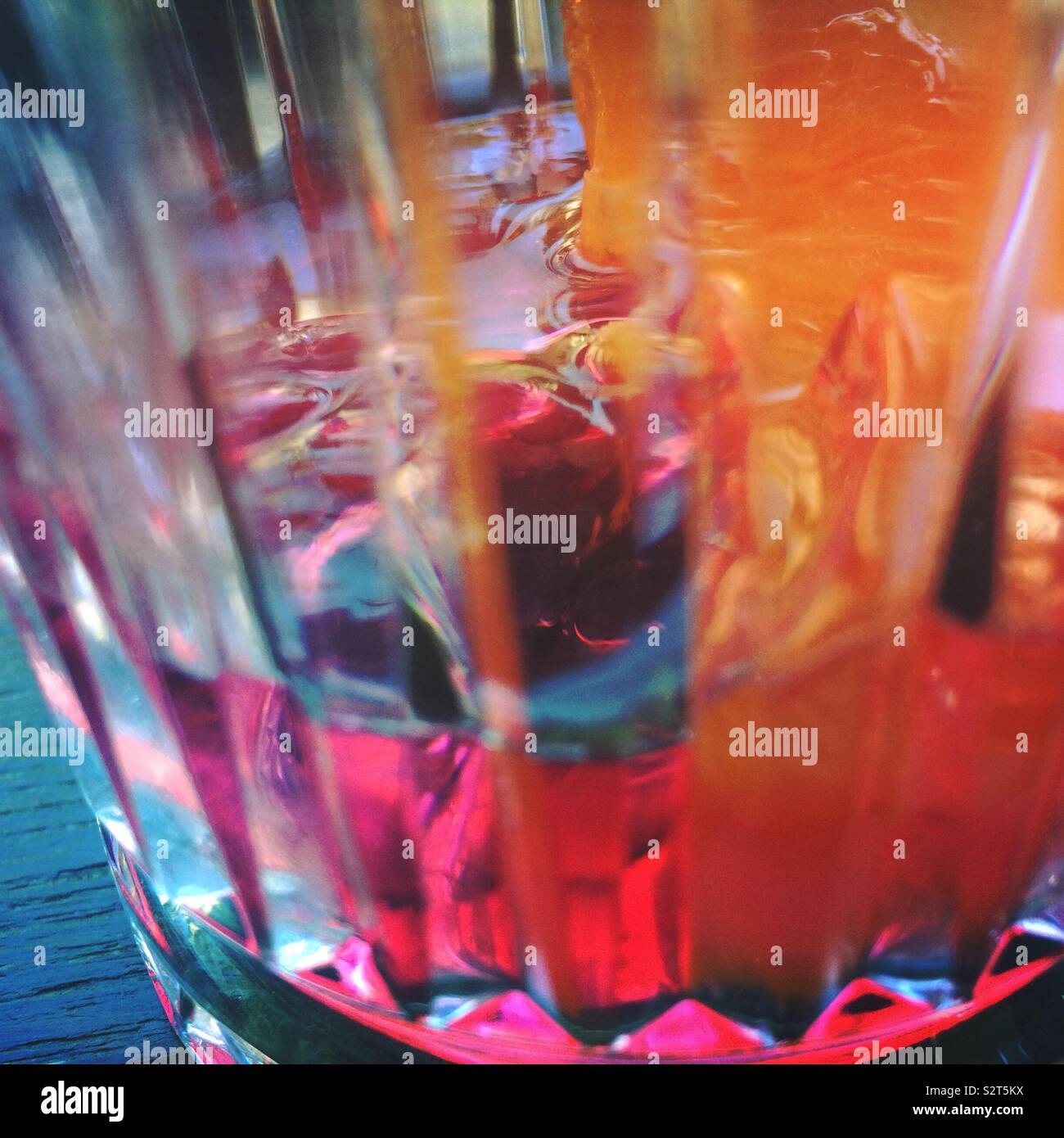 A colourful summertime drink glass and reflections Stock Photo - Alamy