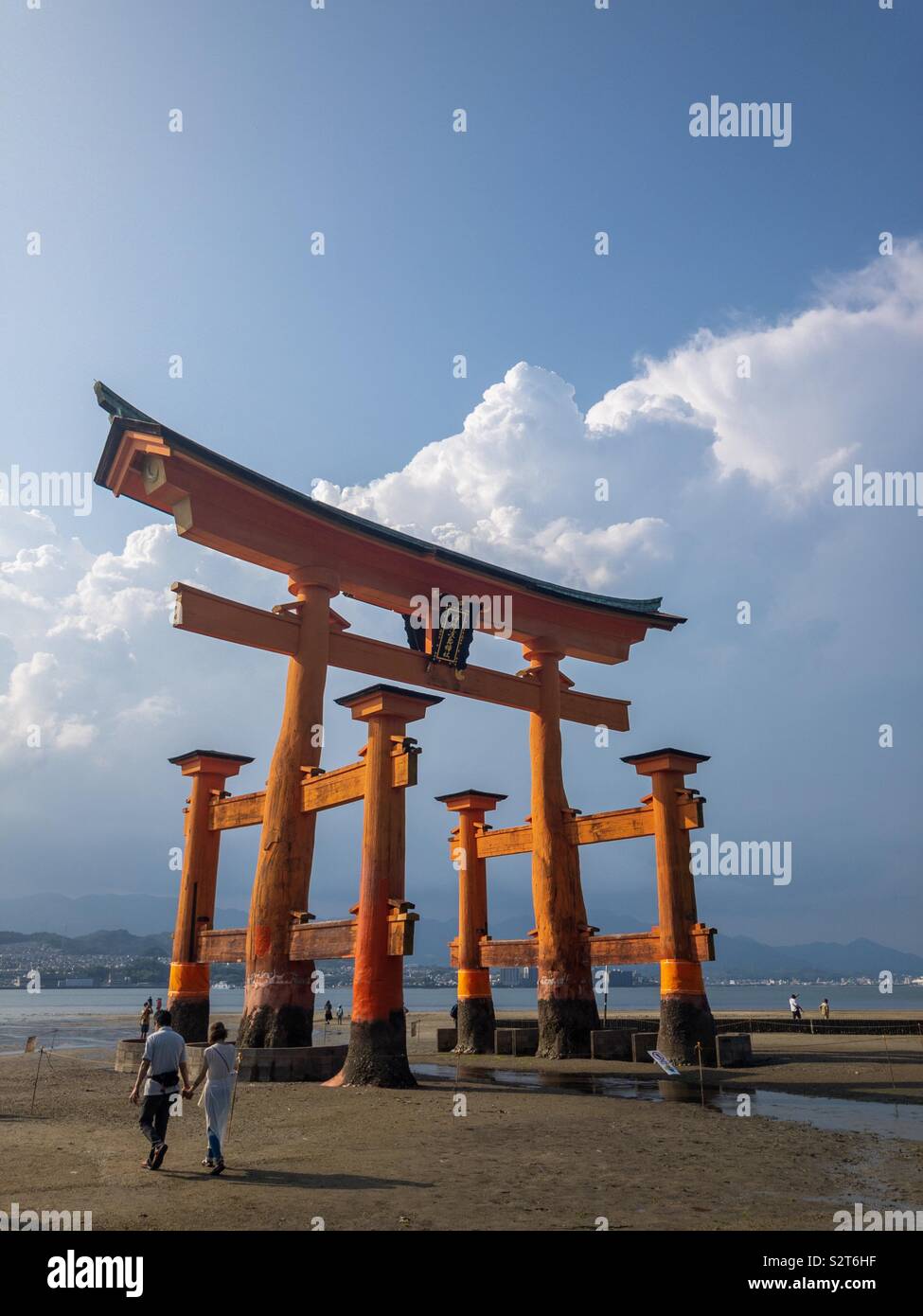 Torii gate at low tide on Itsukushima Miyajima island in Japan Stock ...