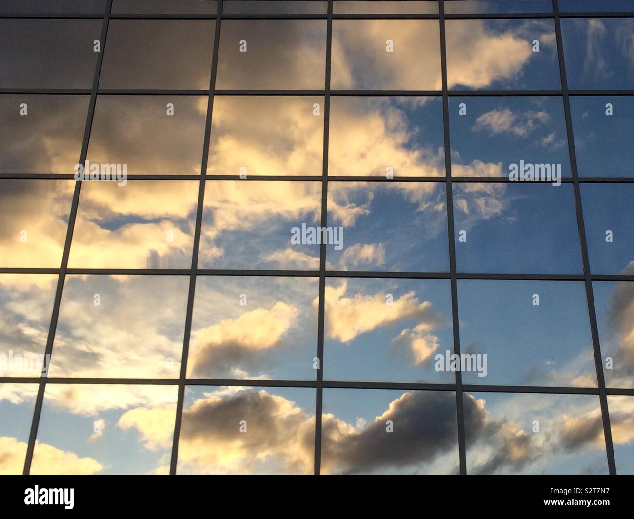 Clouds in window reflection Stock Photo - Alamy