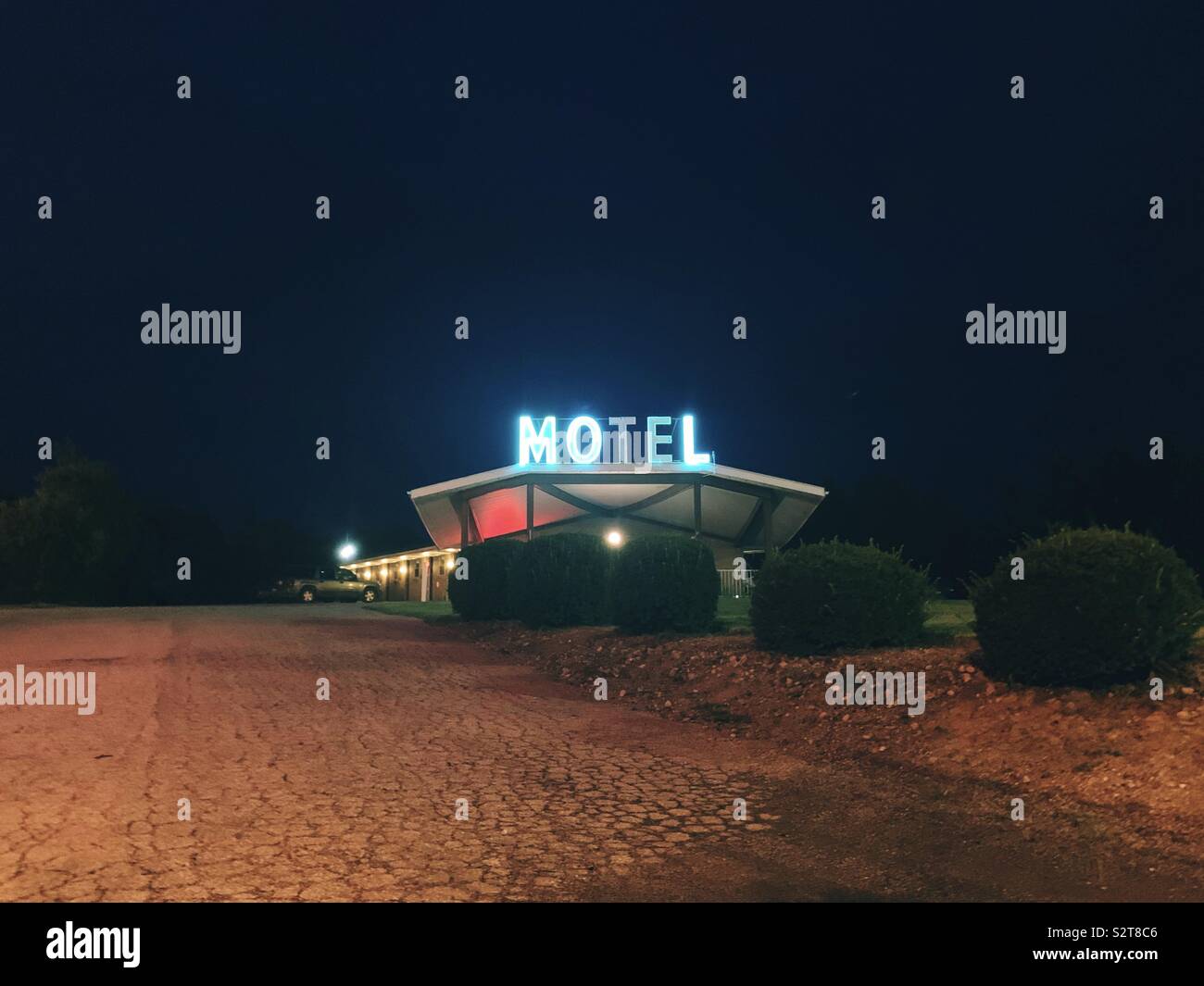Neon Motel sign lit up in the night Stock Photo - Alamy
