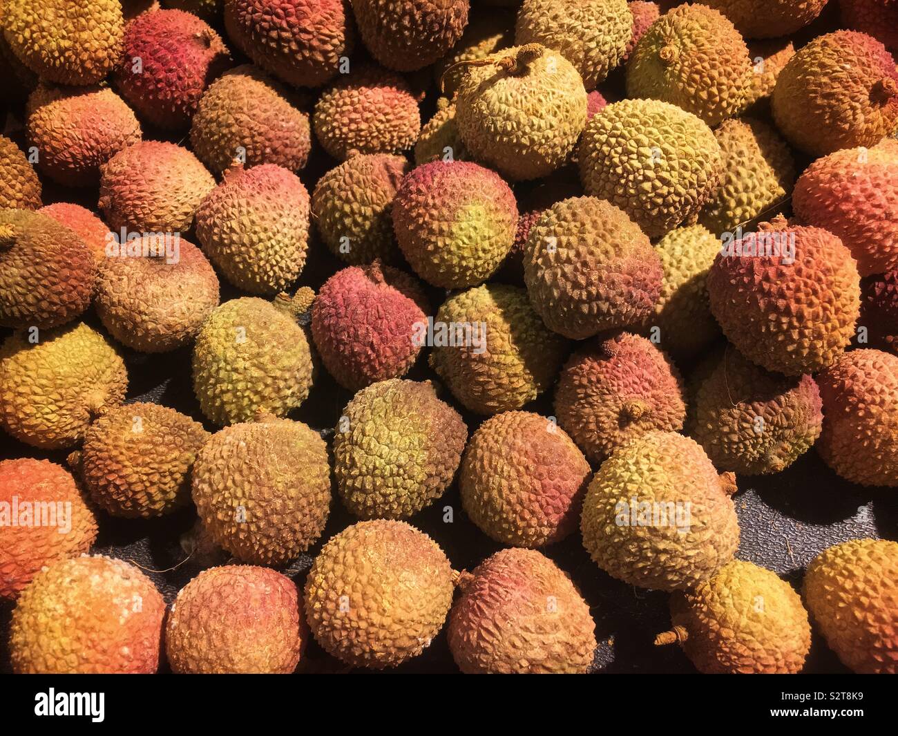Full frame of many ripe lychee nuts scattered on a shelf Stock Photo ...