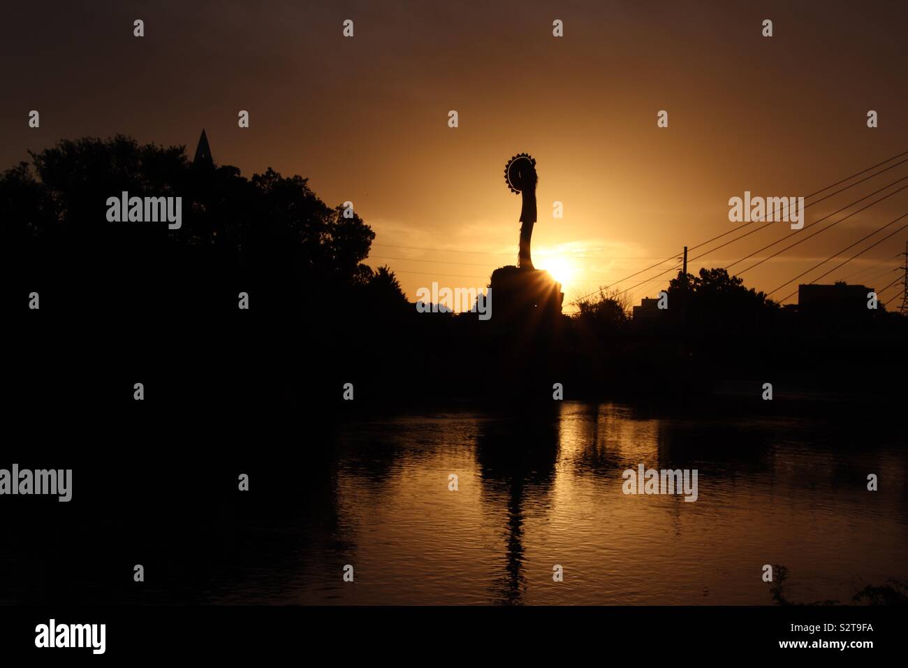 Sunrise behind Keeper of the Plains at theBig Arkansas River Wichita KS ...