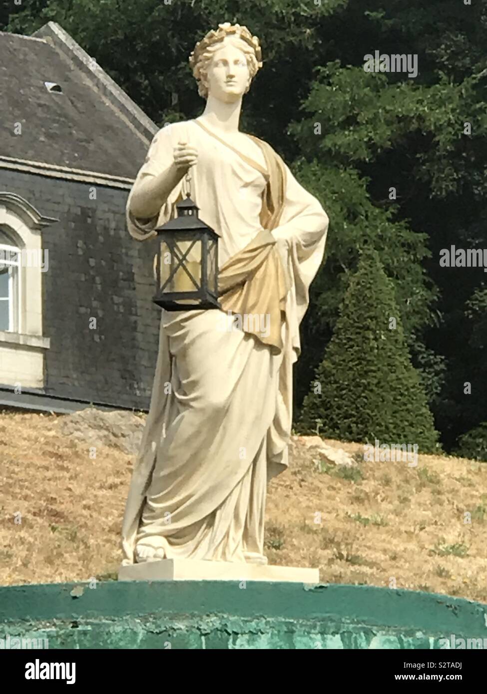 Statue with lantern Stock Photo - Alamy