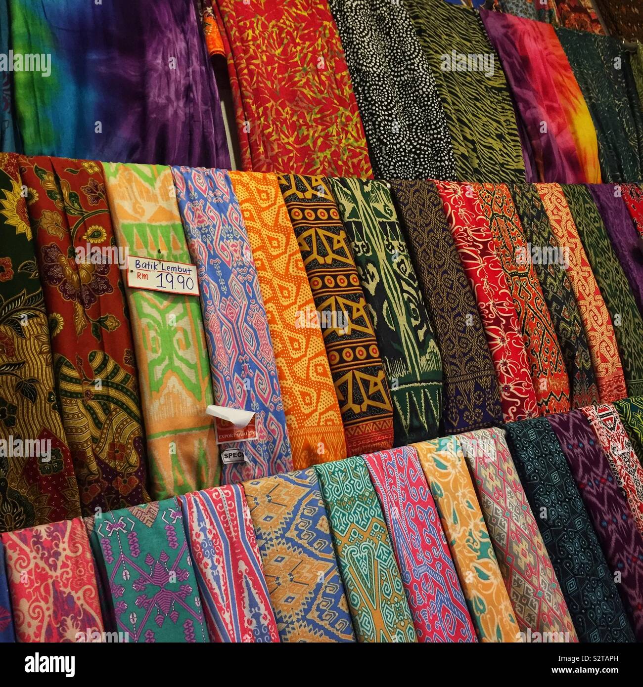 Traditional-design batik sarongs for sale in a souvenir shop in the old ...