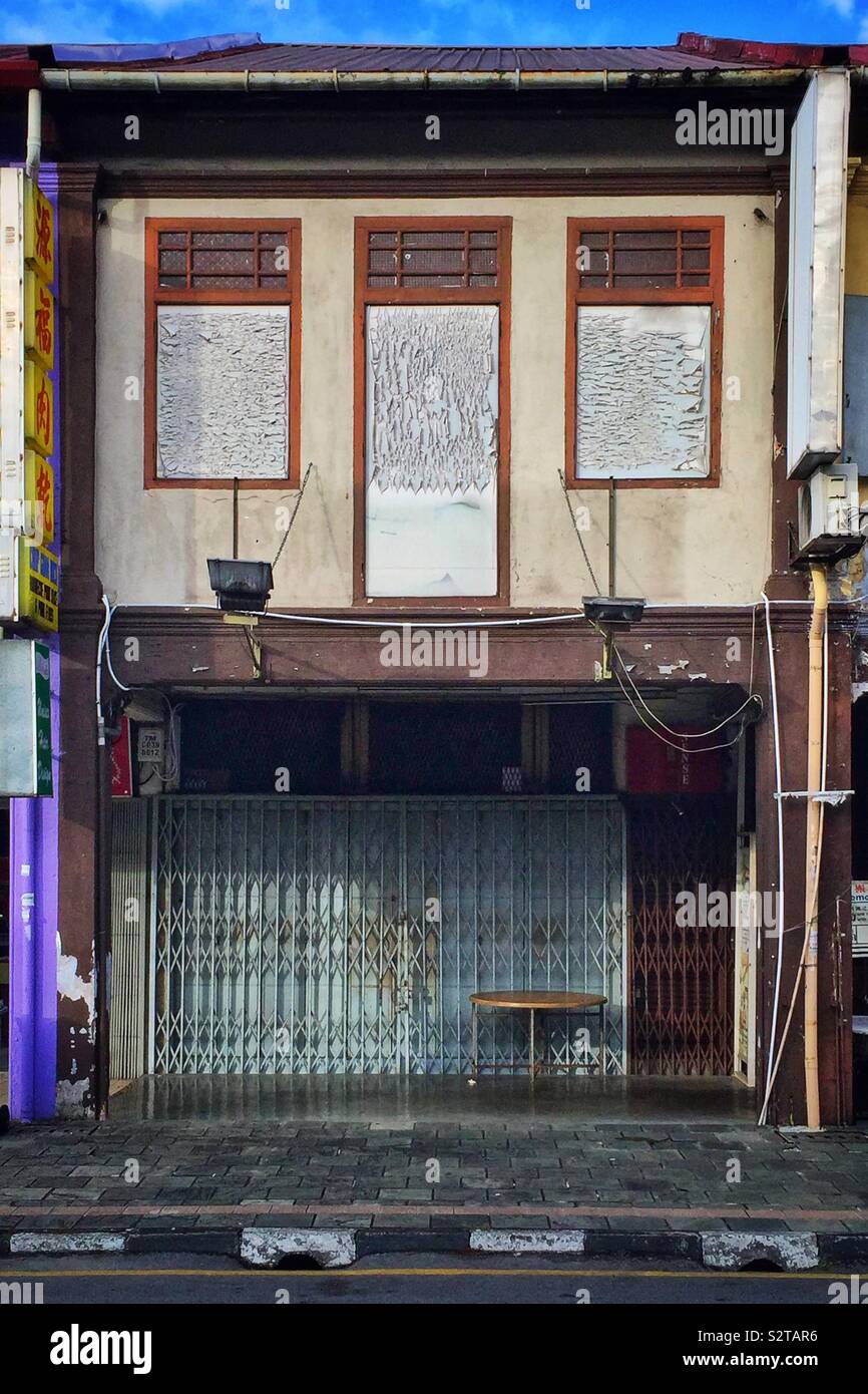 The colourful façade of a terraced shophouse in the old Main Bazaar at ...