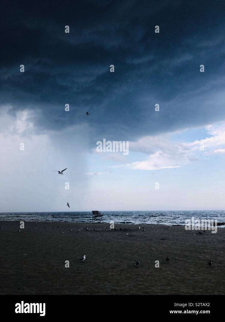 Rain storm at the beach Stock Photo - Alamy