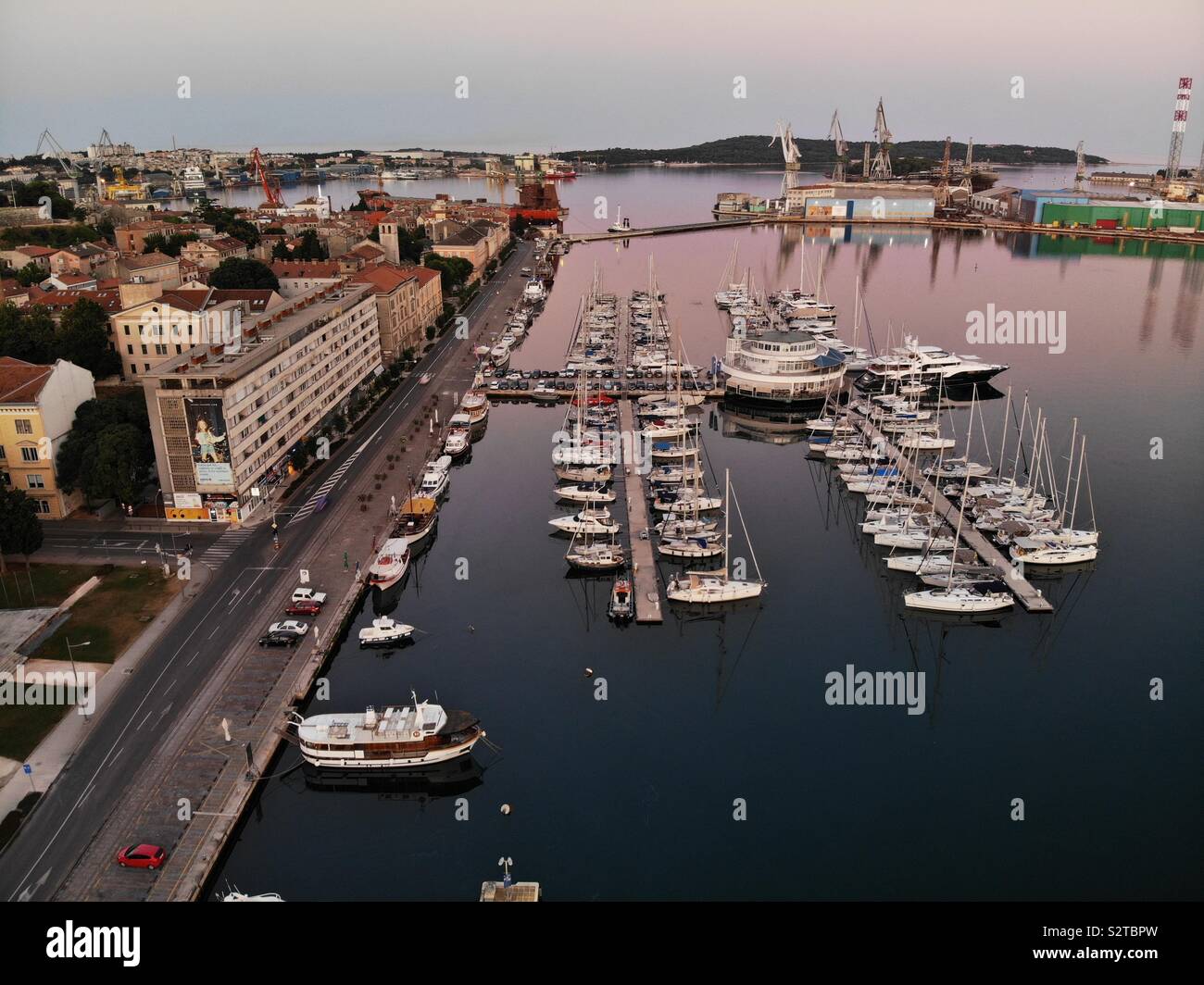 Aerial shot of Pula harbour at sunrise Stock Photo - Alamy