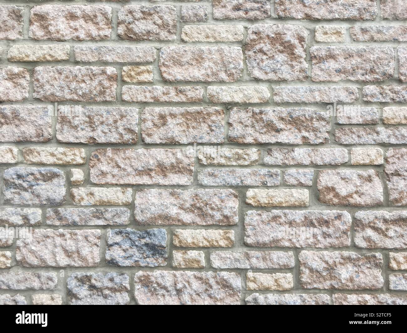 Crushed stone brick wall Stock Photo - Alamy