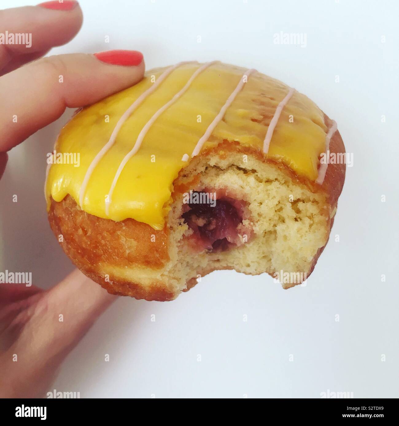 Donut bite hi-res stock photography and images - Alamy