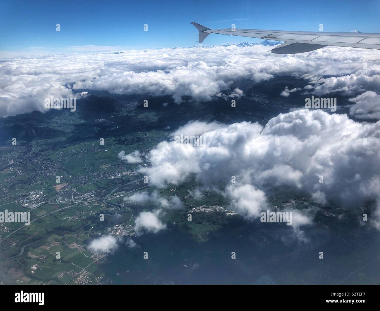 Airplane wing flying above Europe and clouds in spring holiday Stock ...