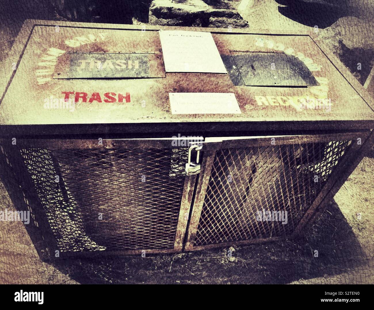 Trash, Recycle box in the park among the forest with a lock on it to ...