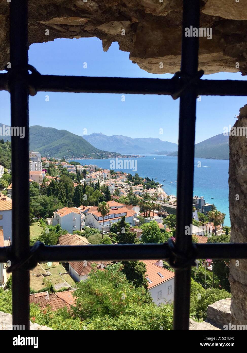 Behind the bars of Kanli Kula fortress at Herceg Novi Stock Photo - Alamy