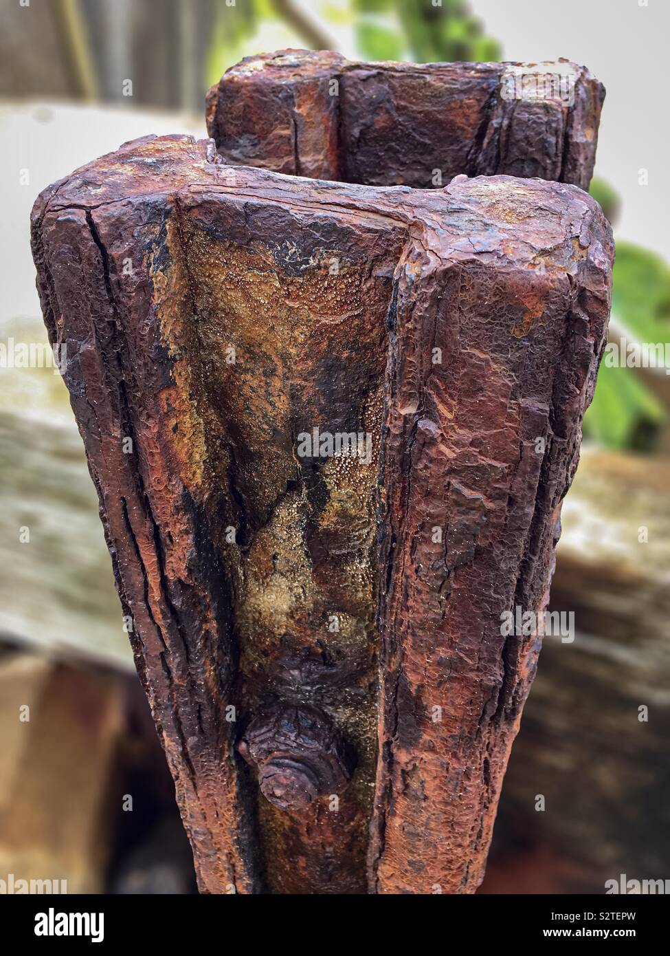Metal post eroded and corroded by the elements and sea Stock Photo - Alamy