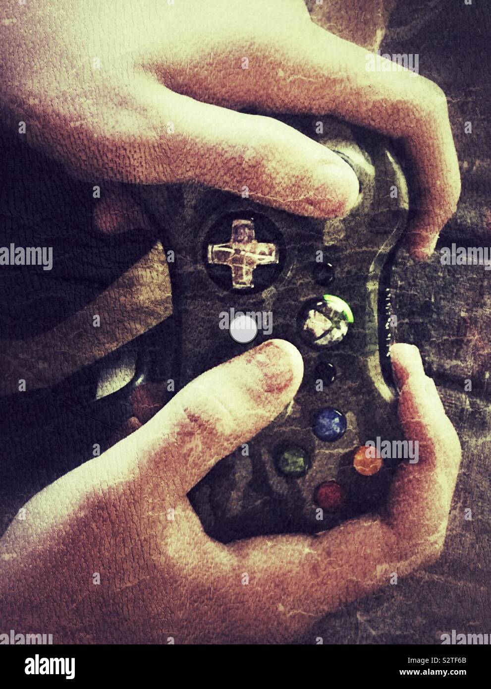 Gamer, hands holding a game remote Stock Photo - Alamy