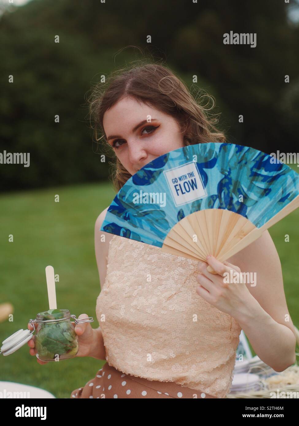 Girl with fan Stock Photo - Alamy