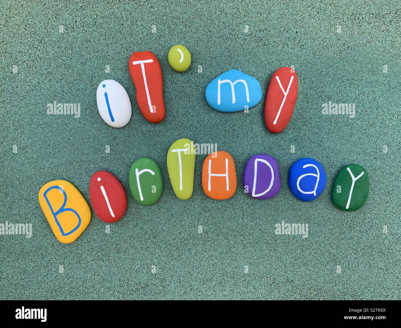 It’s my birthday message celebrated with multi colored stones over ...