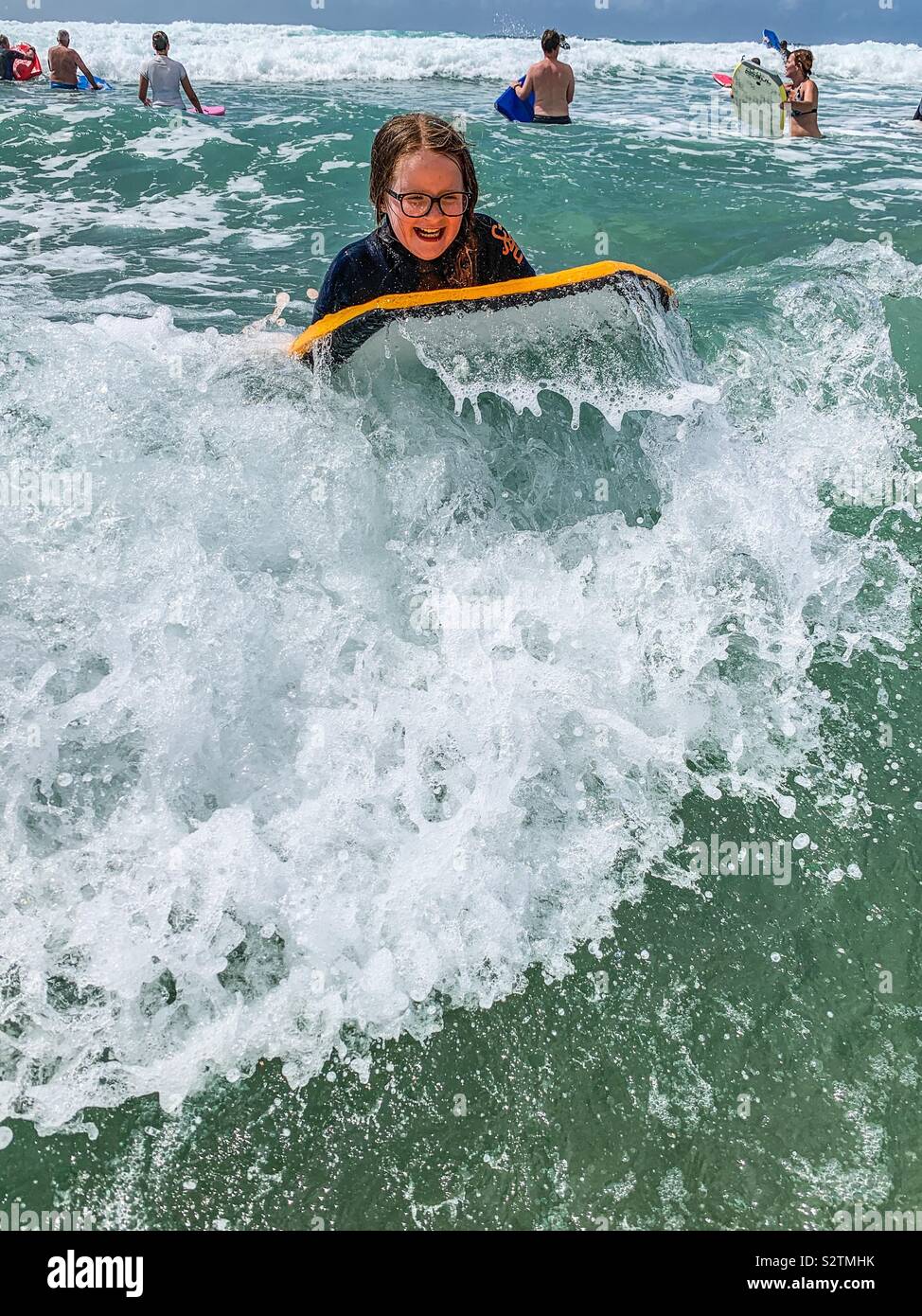 Surfing and having fun on perran beach Cornwall Stock Photo - Alamy