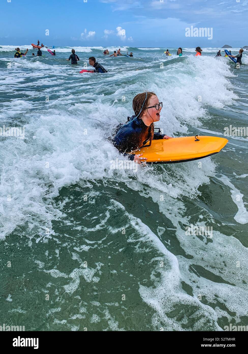 Surfing and having fun on perran beach Cornwall Stock Photo - Alamy