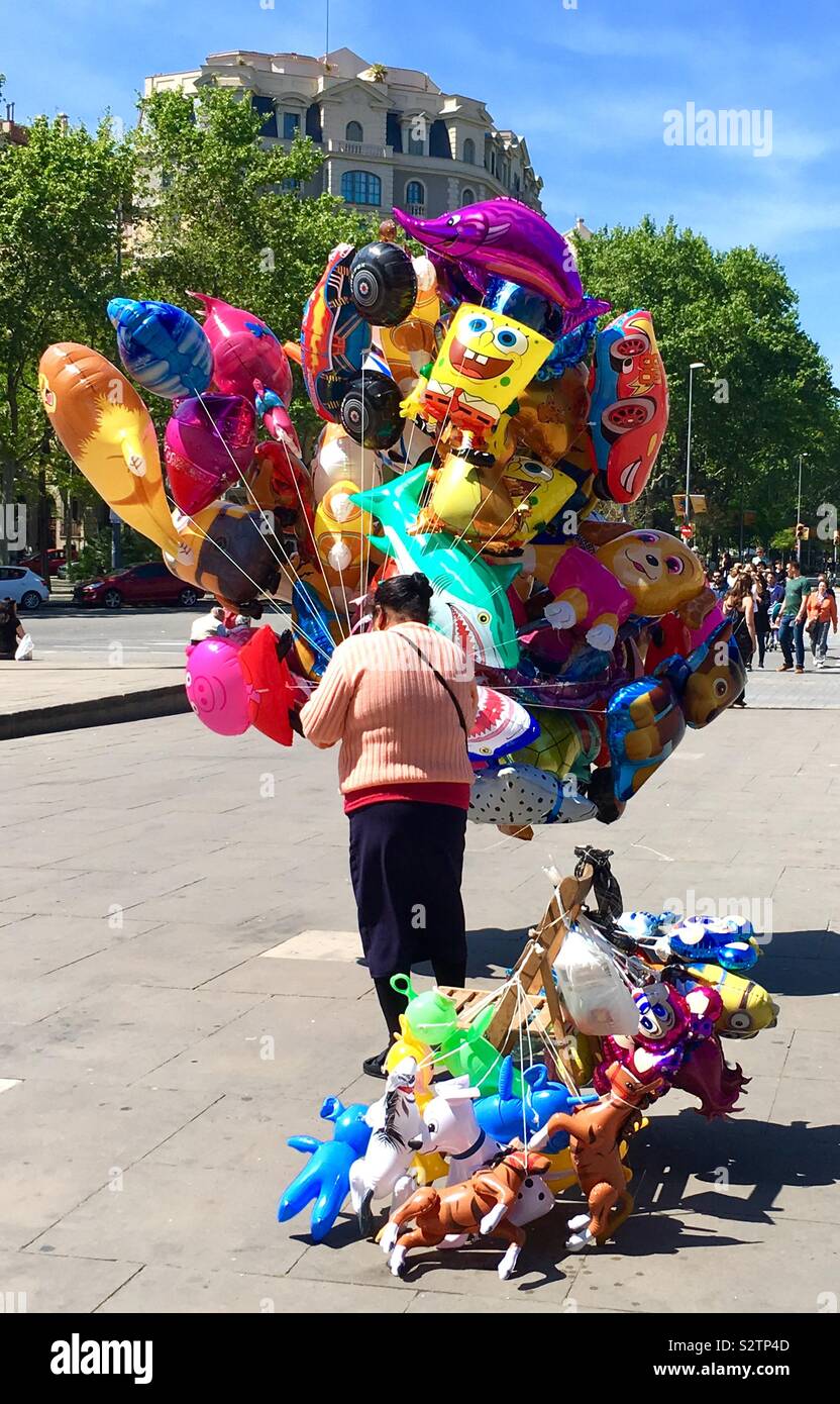 Woman selling balloons hi-res stock photography and images - Alamy