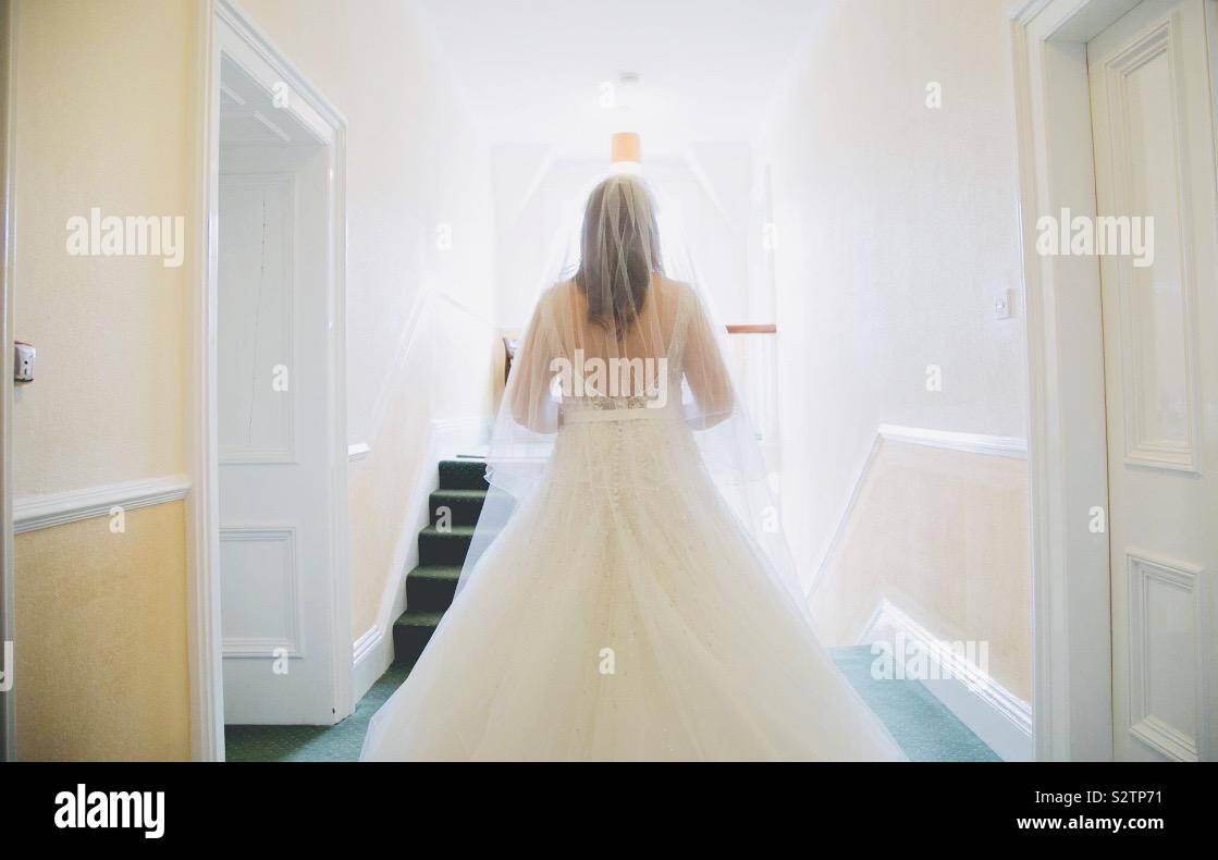 Bride waiting to go to the church - dress from back Stock Photo - Alamy