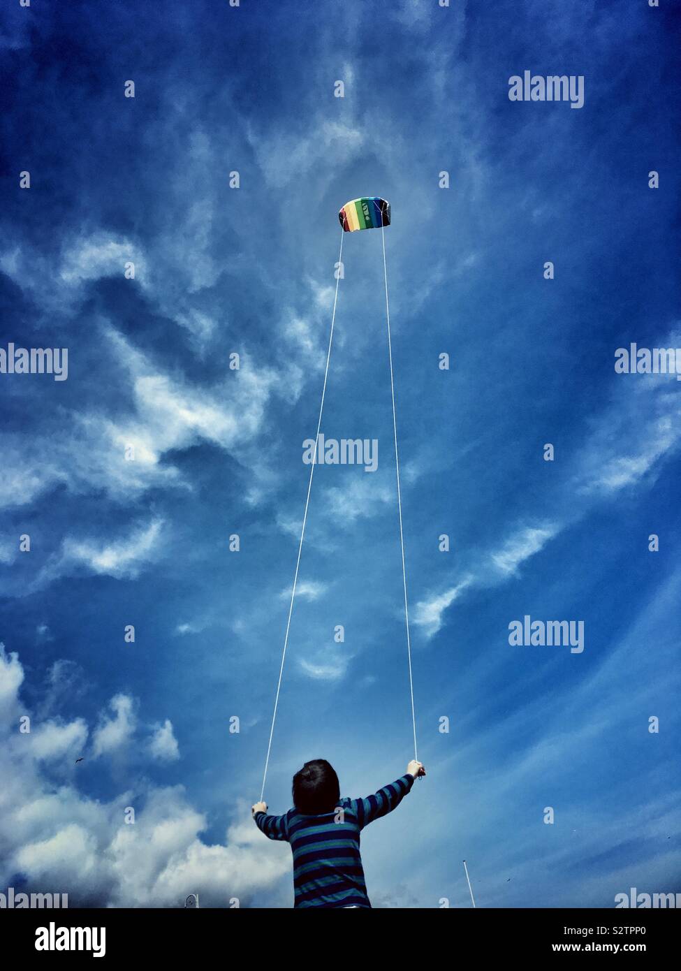Boy flying kite Stock Photo - Alamy